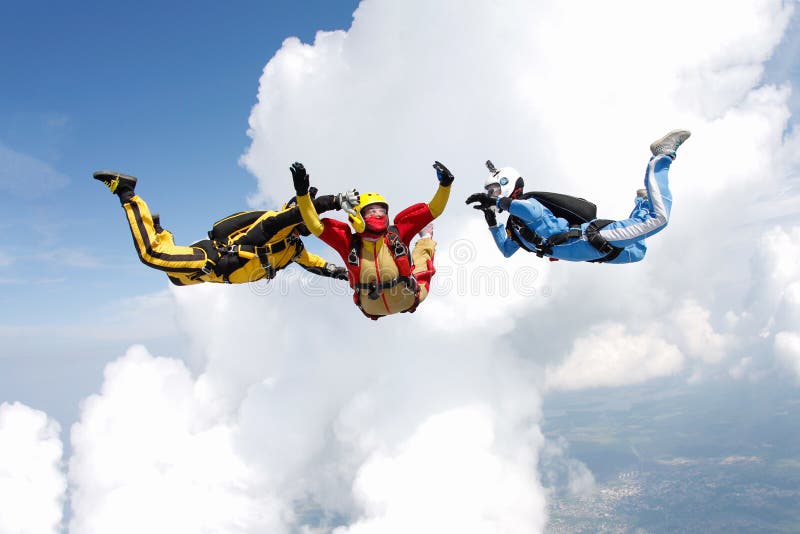 Skydiving. Two Instructors are Training a Student To Fly. Stock Image ...