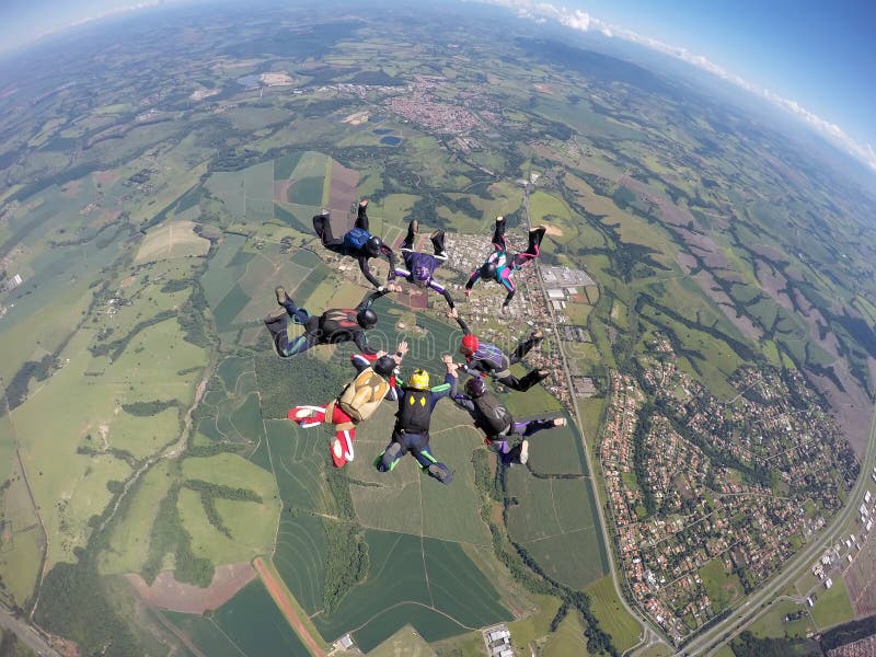 Skydiving group formation editorial image. Image of hands - 139778040