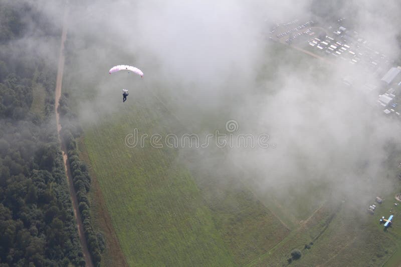 Skydiving. a Parachute is Above the Ground. Stock Photo - Image of ...