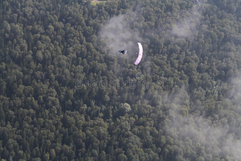 Skydiving. a Parachute is Above the Ground. Stock Image - Image of ...