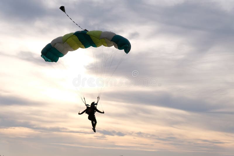 Skydiving. a Parachute is Flying in the Beautiful Sunset Sky. Stock ...
