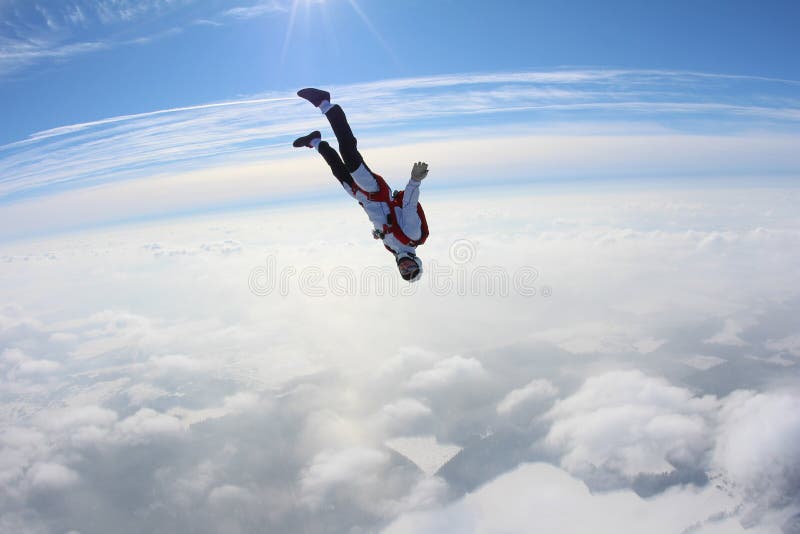 Skydiving. Skydiver is Falling Above Clouds. Stock Photo - Image of ...