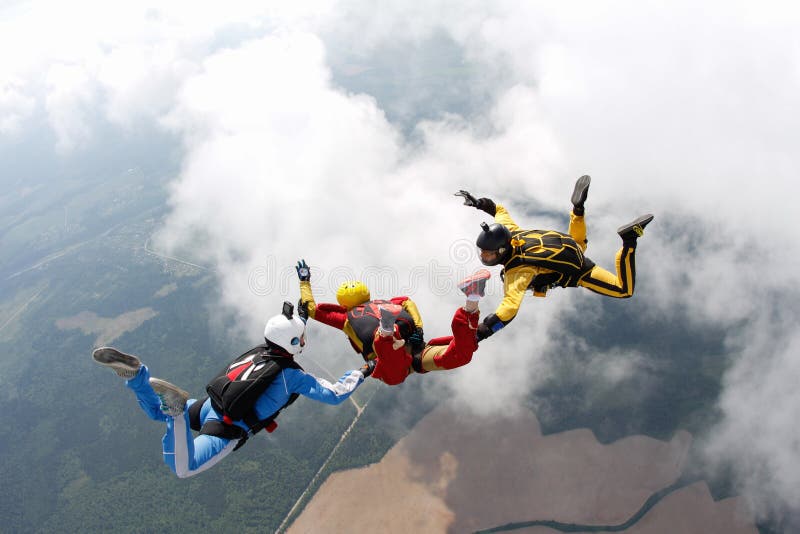 Skydiving. Two Instructors are Training a Student To Fly. Stock Photo ...