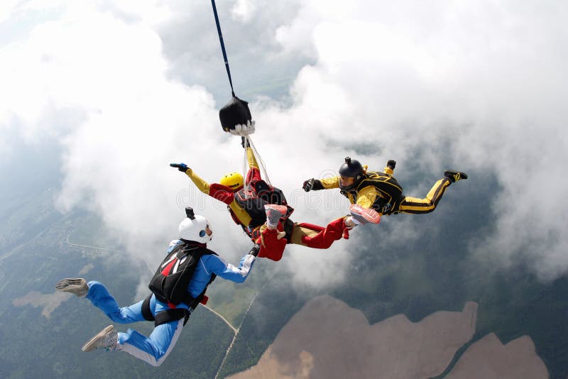 Skydiving. Two Instructors are Training a Student To Fly. Stock Photo ...