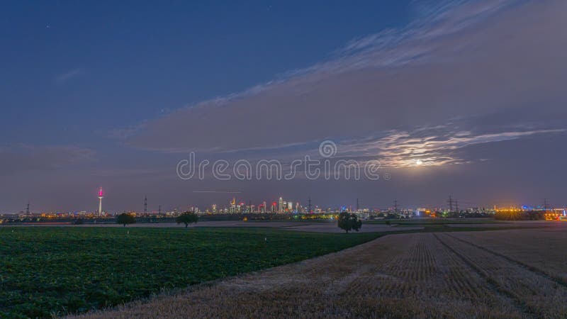 Skyline of Distant Buildings with Night Lights Captured Against a Dark ...