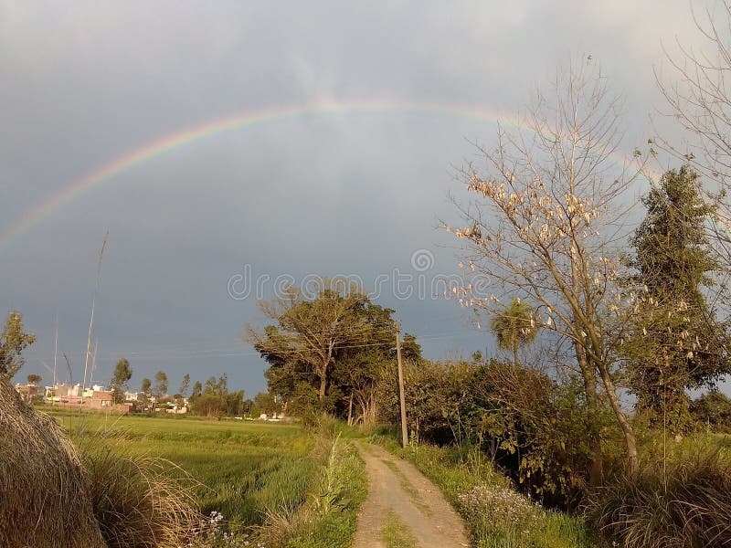 Skyline after Rain and Scenic View of Rainbow. Stock Photo - Image of ...