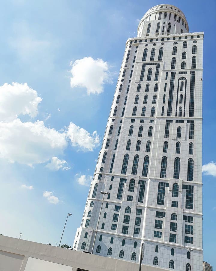 Skyscaper with clouds stock image. Image of blue, urban - 142037863