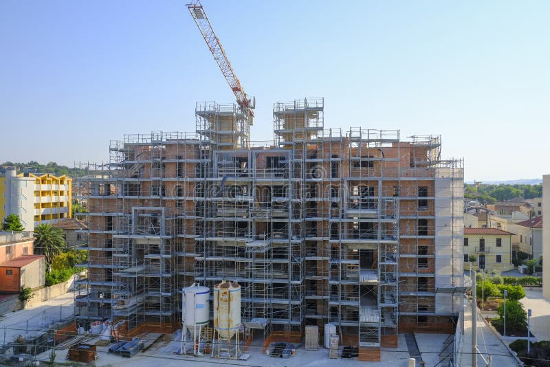 Skyscraper in Construction Close-up with a Crane. Building Construction ...