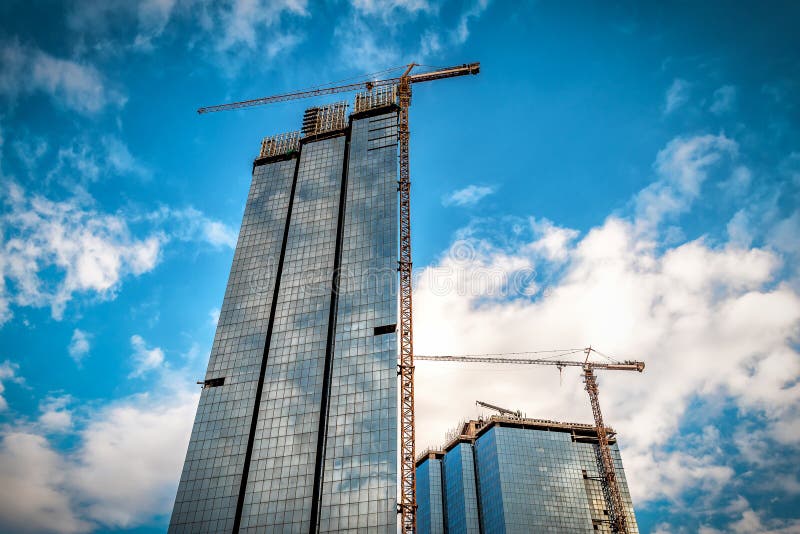 Skyscraper Construction Site with Cranes on Sky Background Stock Image ...