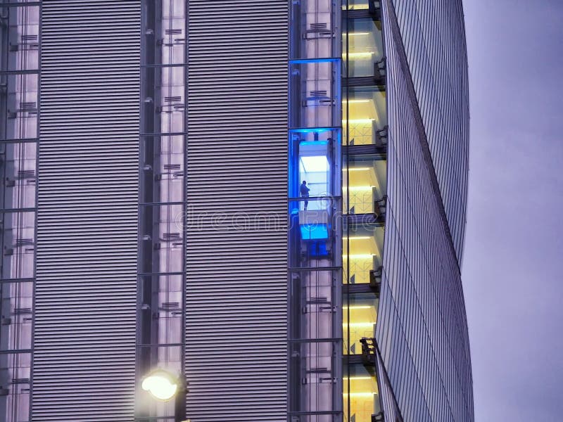 Skyscraper External Elevator with Persons Silhouette Inside Stock Photo ...