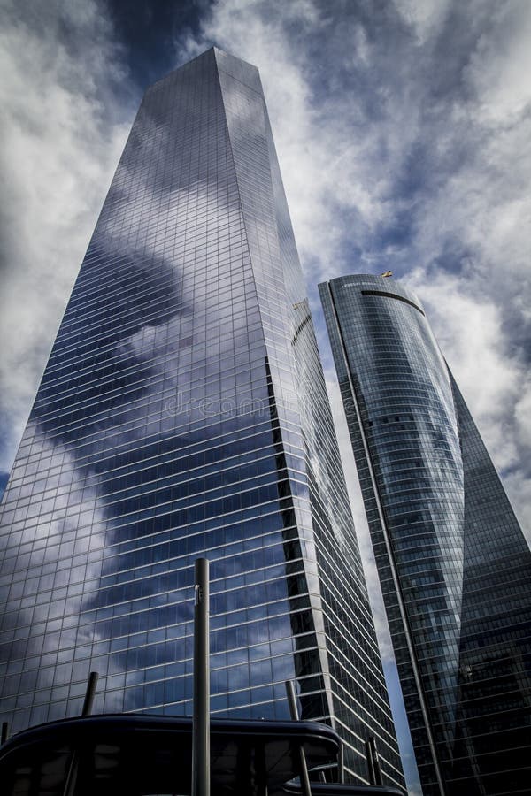 Skyscraper with Glass Facade and Clouds Reflected in Windows Stock ...