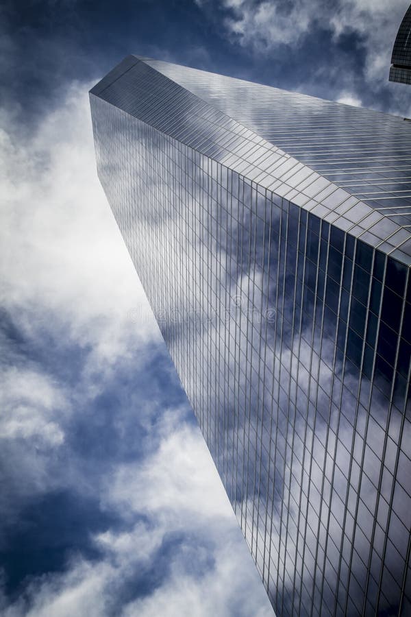Skyscraper with Glass Facade and Clouds Reflected in Windows Stock ...