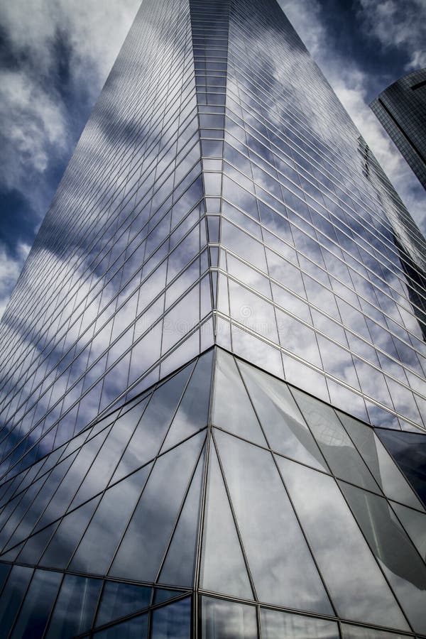 Skyscraper with Glass Facade and Clouds Reflected in Windows Stock ...