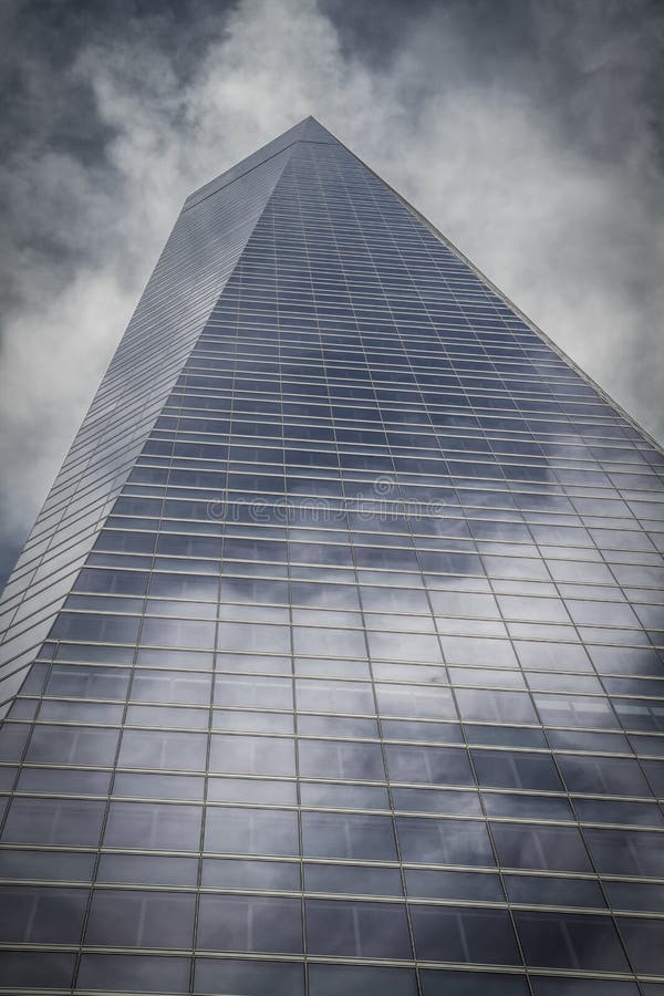 Skyscraper with Glass Facade and Clouds Reflected in Windows Stock ...