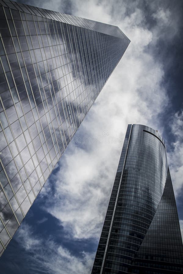 Skyscraper with Glass Facade and Clouds Reflected in Windows Stock ...