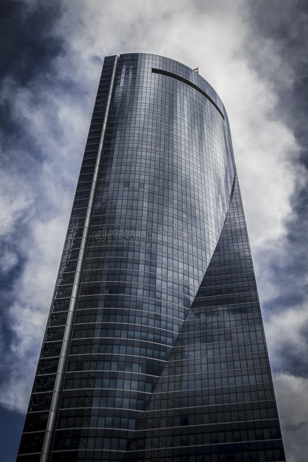 Skyscraper with Glass Facade and Clouds Reflected in Windows Stock ...
