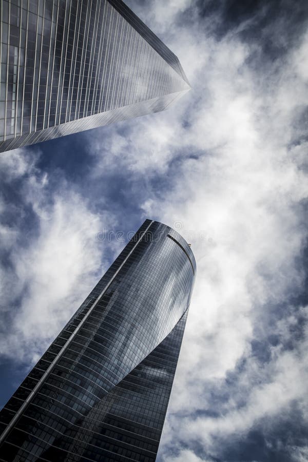 Skyscraper with Glass Facade and Clouds Reflected in Windows Stock ...