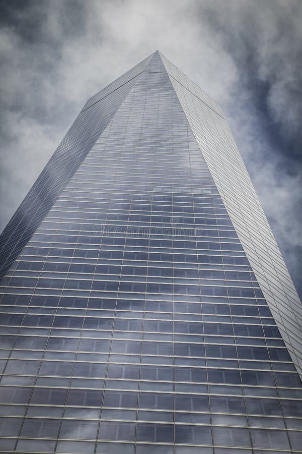 Skyscraper with Glass Facade and Clouds Reflected in Windows Stock ...