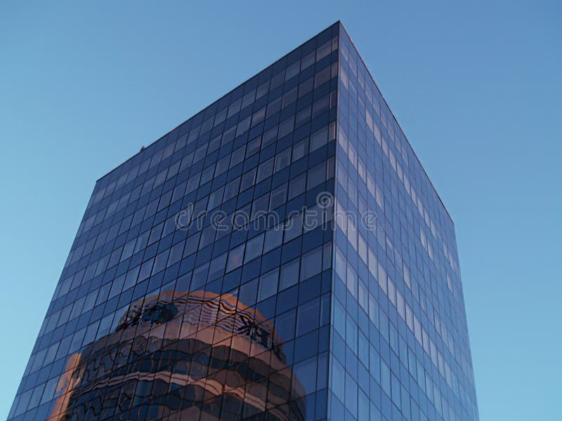 Skyscraper Reflected in a Blue Building with Glass Windows Editorial ...