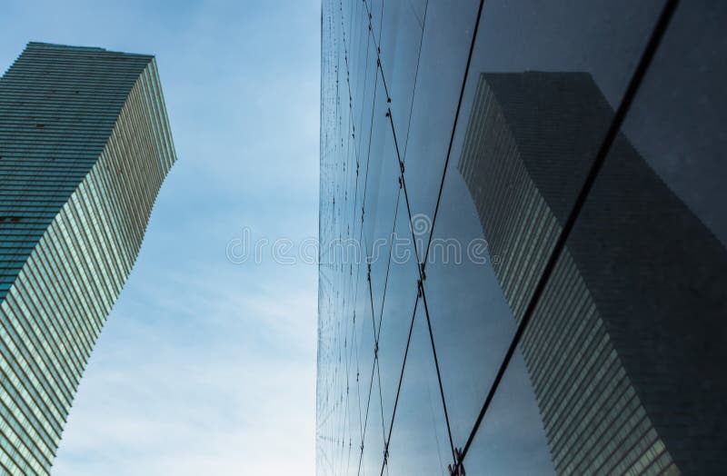 The Skyscraper is Reflected in the Windows of the Facade of a Modern ...
