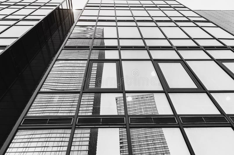 The Skyscraper is Reflected in the Windows of the Facade of a Modern ...