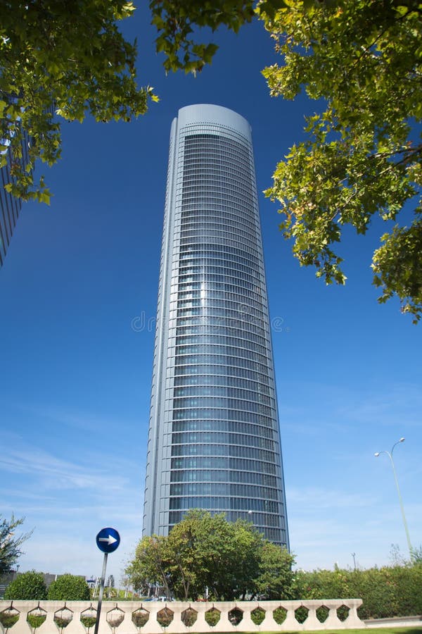 Skyscraper between trees stock image. Image of blue, spain - 12240147