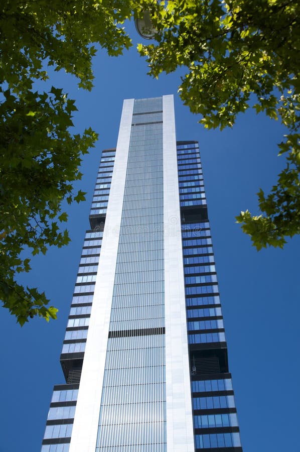 Skyscraper between trees stock image. Image of blue, spain - 12240147