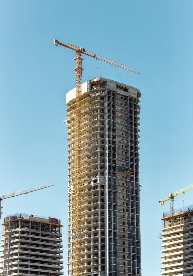 Skyscraper Under Construction with a Crane, High-rise Concrete ...