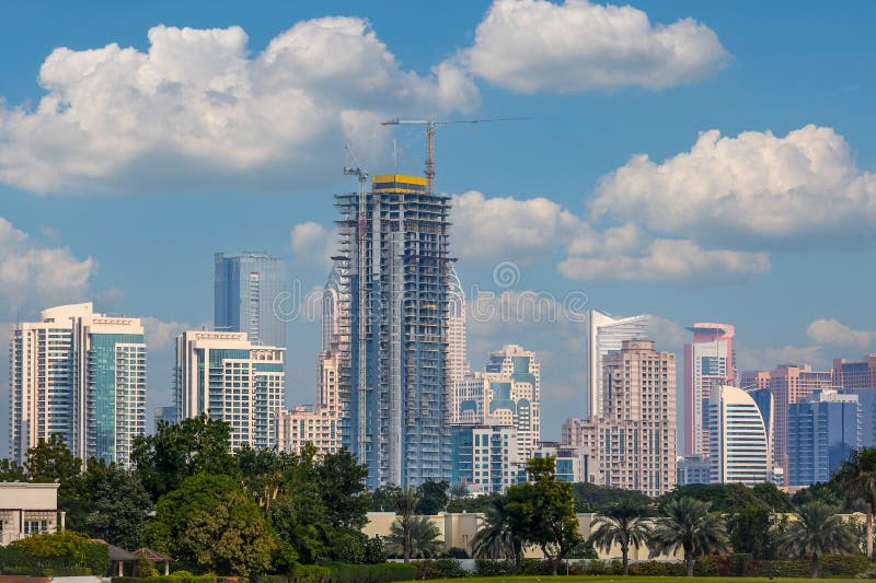 Skyscraper Under Construction in Urban Skyline with Cranes and Modern ...