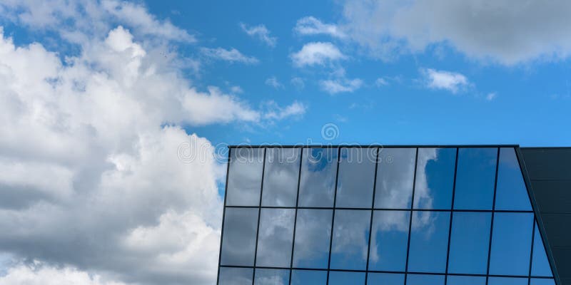 Skyscraper Upper Levels Against Cumulus Clouds in Blue Sky Stock Image ...