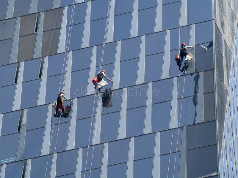Skyscraper Window Cleaners Washing a Window in Doha, Qatar Editorial ...