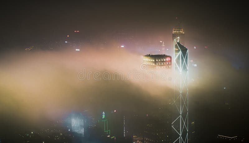 Skyscrapers of a City at Night Covered in Mist Stock Image - Image of ...