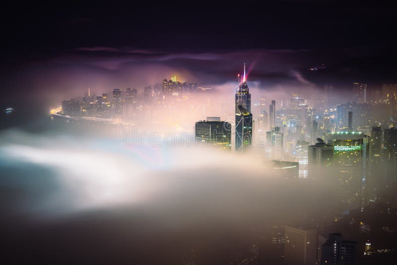 Skyscrapers of a City at Night Covered in Mist Stock Photo - Image of ...