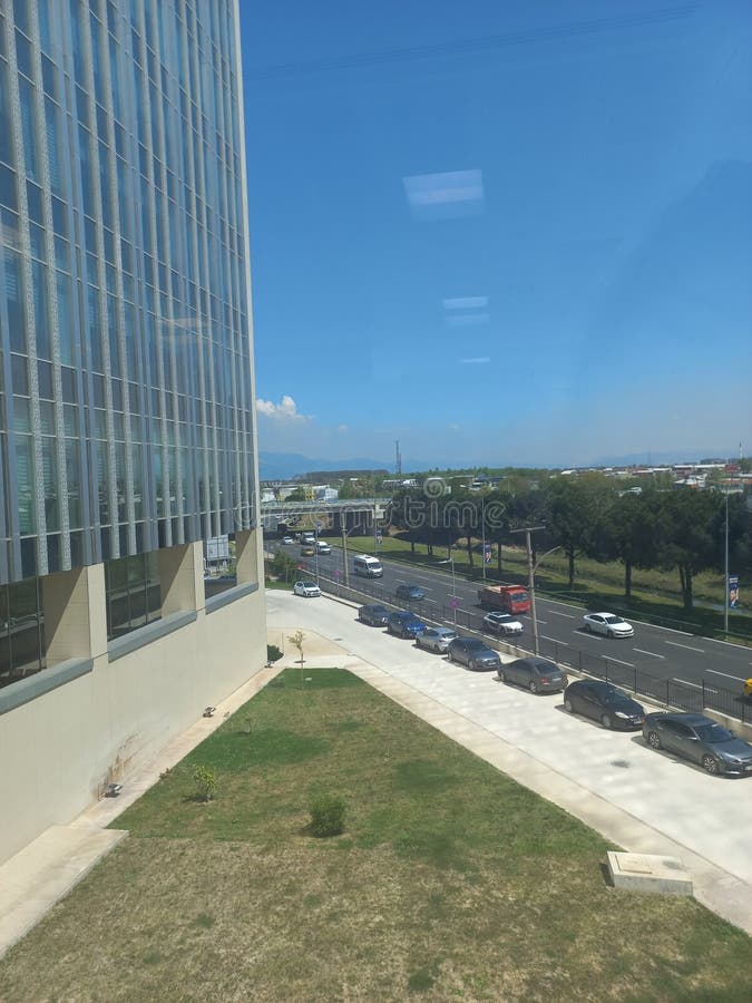Tall Building Overlooking Forests, Sea and Parking Stock Image - Image ...