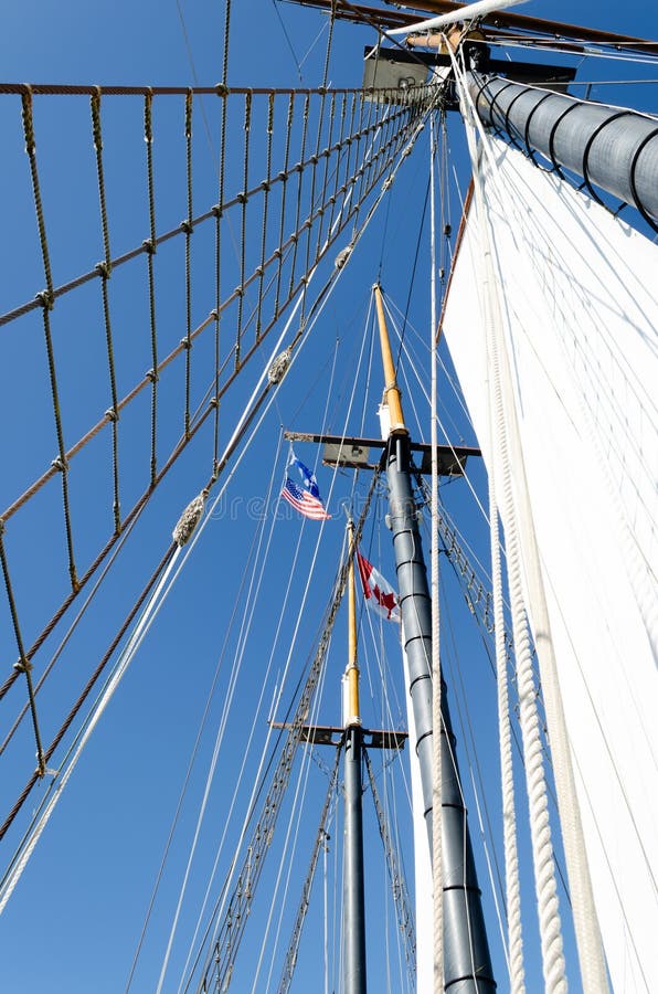 Skyward View of Three Tall Ship Masts and Sails Showing Canada and USA ...