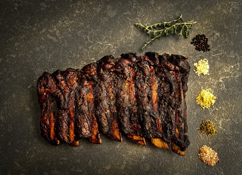 Slab of Beef Ribs with Spices in Piles on Granite Stock Image - Image ...