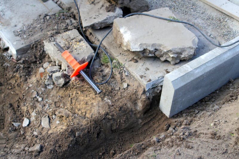 Slab Paving Process with Chisel and Angle Grinder. Earth Dig for Slab ...