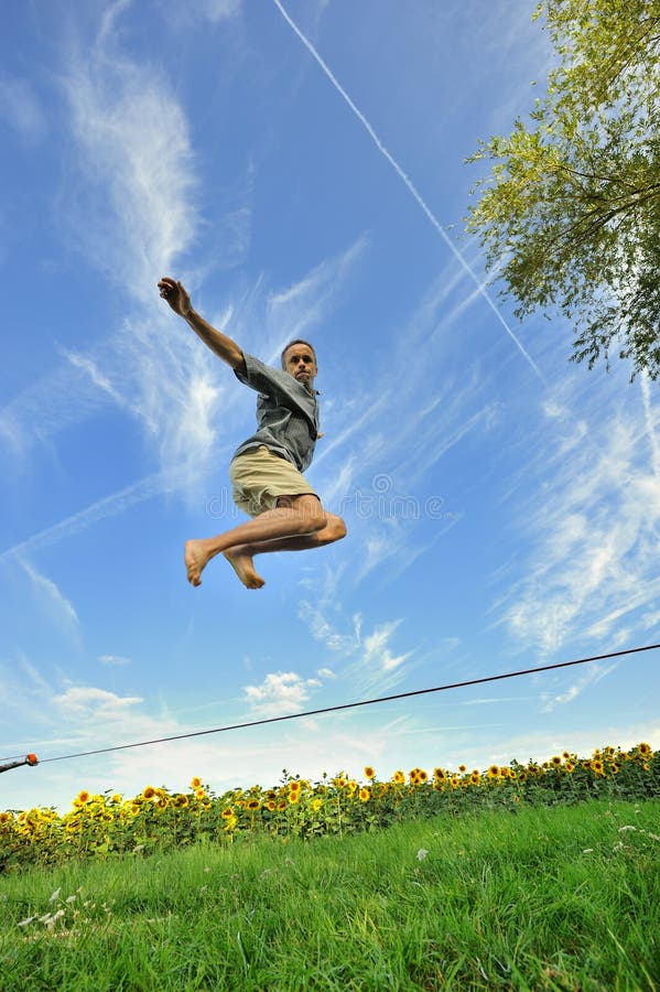 Jumping on slackline stock photo. Image of person, line - 30542218