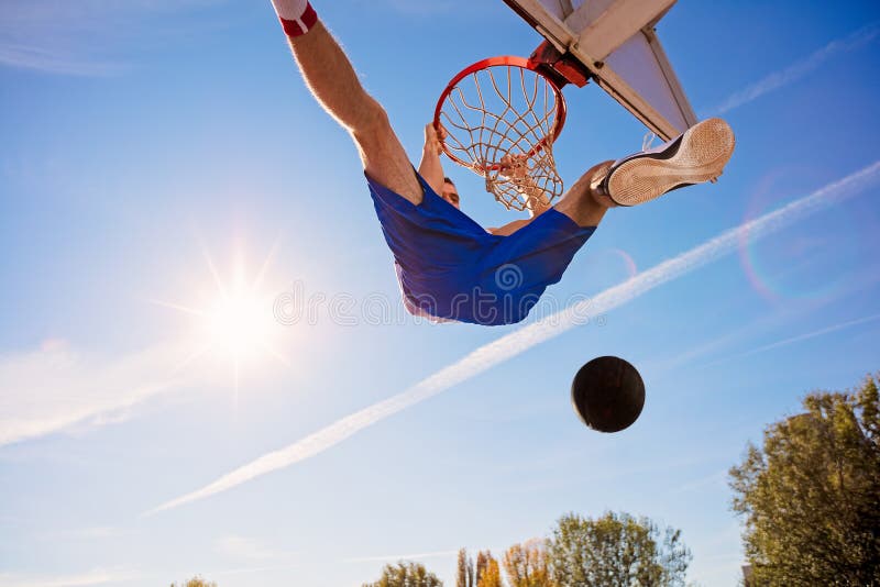 Slam Dunk. Side View of Young Basketball Player Making Slam Dunk Stock ...