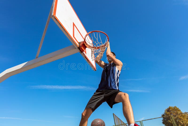 High Angle View of Basketball Player Dunking Basketball in Hoop Stock ...