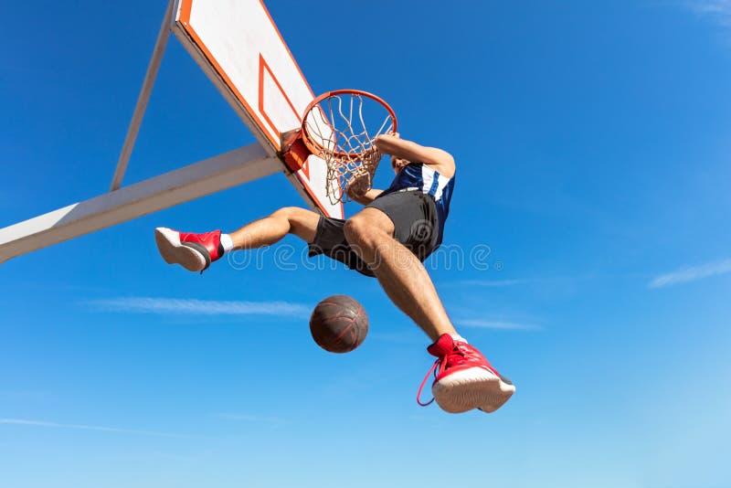 High Angle View of Basketball Player Dunking Basketball in Hoop Stock ...