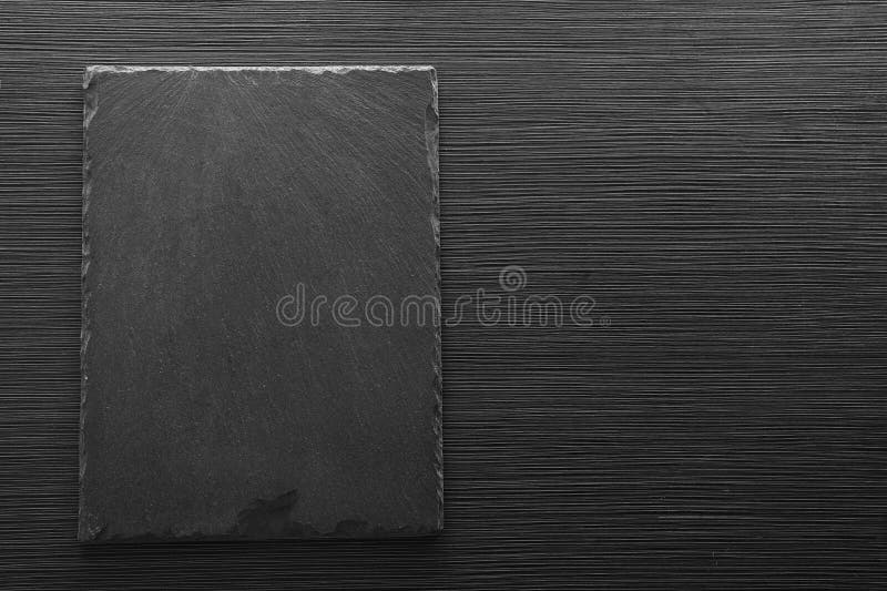 Slate Board on Black Wooden Table, Top View. Space for Text Stock Photo ...