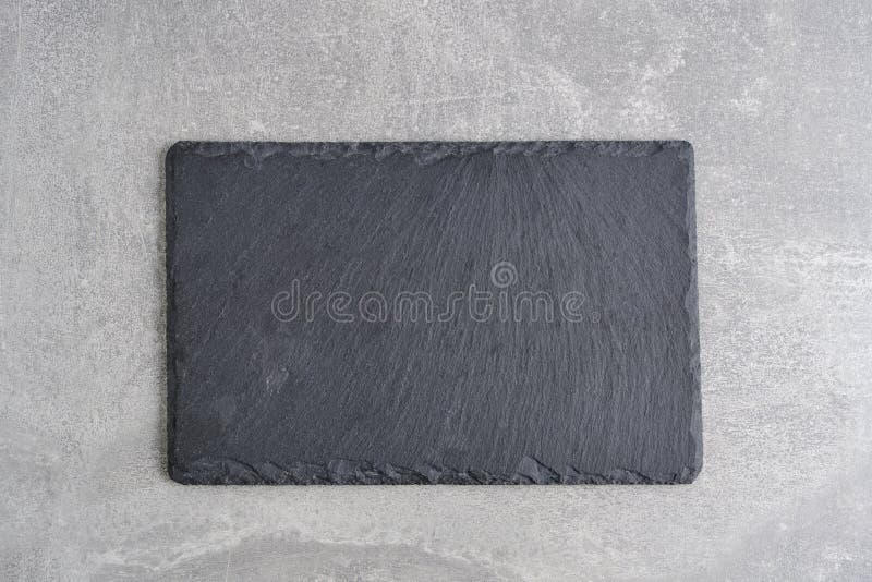 Slate Cutting Board on a Light Concrete Background Stock Photo - Image ...