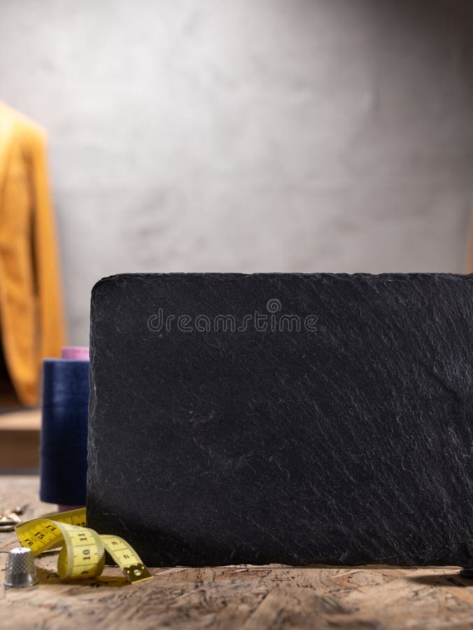 Slate Nameplate and Sewing Tools on Wood Table. Concept of Clothes ...