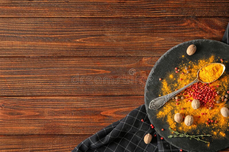 Slate Plate with Different Aromatic Spices on Wooden Table Stock Photo ... Slate Plate with Different Aromatic Spices on Wooden Table Stock Photo ...