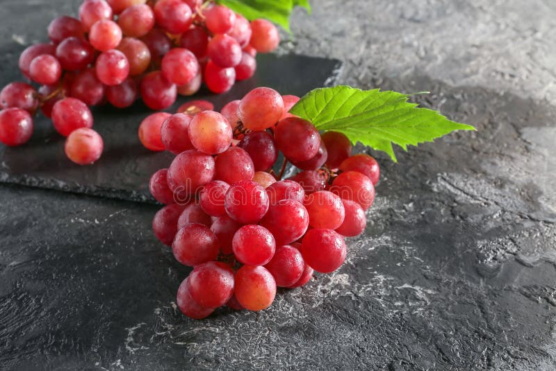 Slate Plate with Ripe Grapes on Grunge Table Stock Image - Image of ...