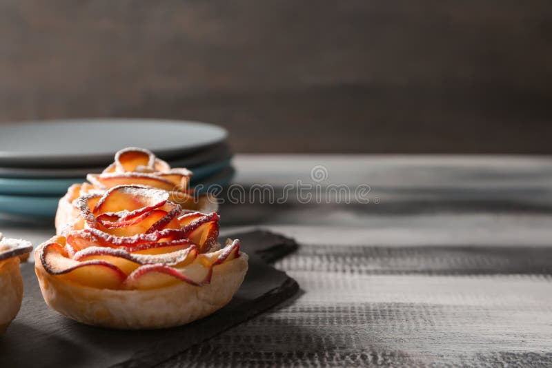 Slate Plate with Rose Shaped Apple Pastry on Table Stock Photo - Image ...