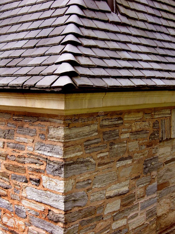 Slate roof with stone wall stock image. Image of exterior - 1189023