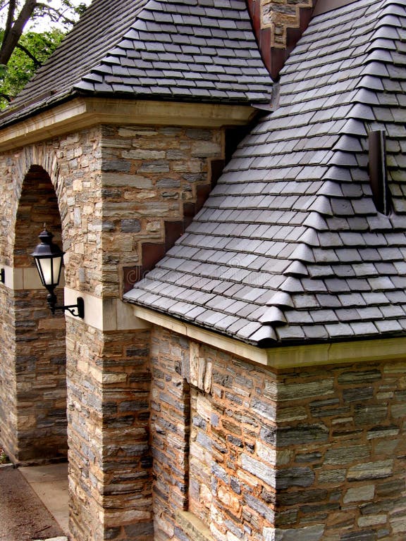 Slate roof with stone wall stock image. Image of roofing - 1189063