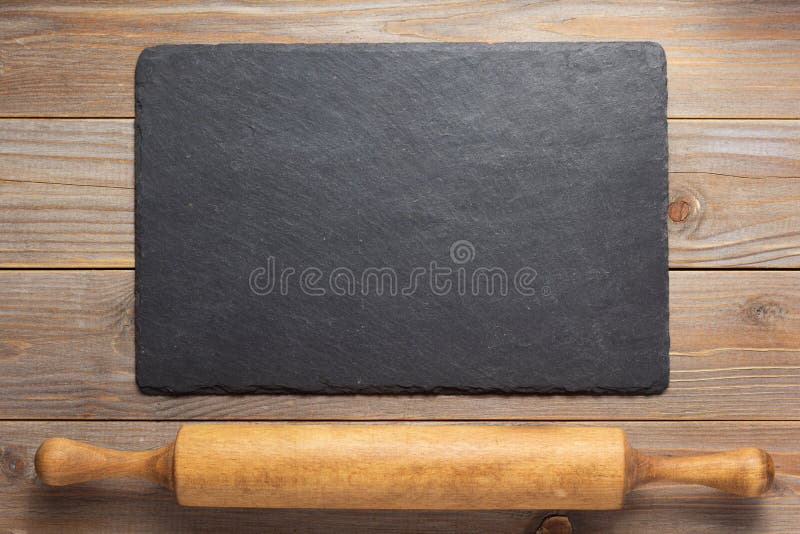 Slate Stone and Rolling Pin at Rustic Wooden Background Stock Image ...